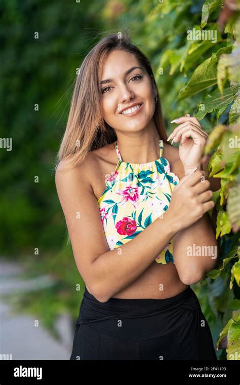 Happy Young Girl With Beautiful Straight Hair Standing Outdoors Happy
