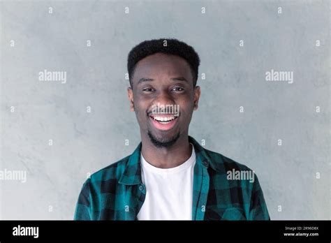 Handsome Young Unshaven Dark Skinned Male Laughing Showing His Straight
