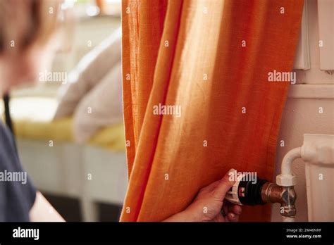 Woman Turning Radiator Thermostat Stock Photo Alamy