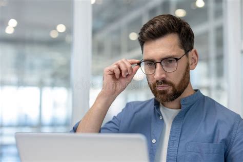 Serious Thinking Man Close Up Working With Laptop Inside Office Mature Experienced Businessman