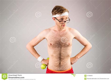 Geeky Shirtless Hipster Flexing Biceps Royalty Free Stock Photography