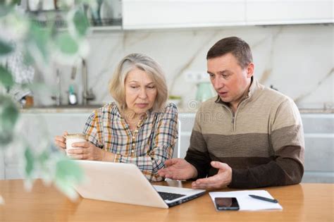 Man And A Woman Fill Out Electronic Documents Together Via Internet Stock Photo Image Of Male