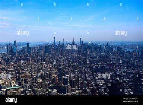 An Aerial View Of A Modern City With Tall Buildings In The Morning