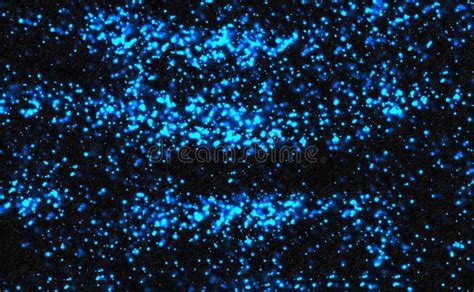 Abstract Blue Particles Floating And Glowing Softly On A Black Background Creating A