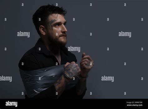 Man Taped Up And Taken Hostage On Grey Background Space For Text Stock