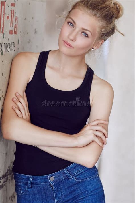 Blond Woman In Jeans Shorts And Black Shirt Stock Image Image Of