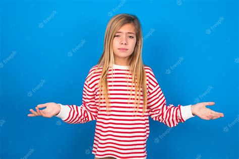 Premium Photo Teen Girl Wearing Red And White Striped Shirt Looks