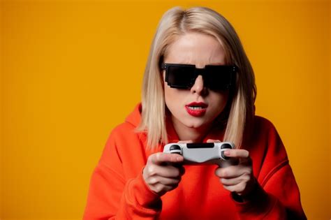 Premium Photo Girl In Sunglasses Plays With A Joystick