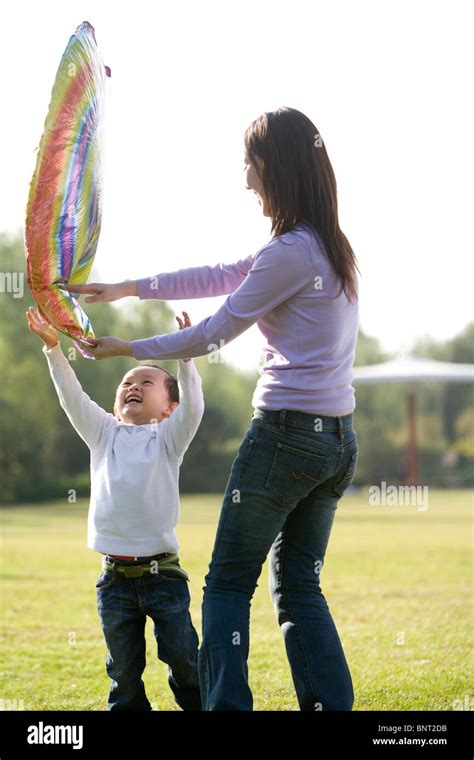 Portrait Of Mother And Son At The Park Stock Photo Alamy