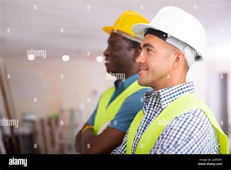 Positive Engineers Inspecting Construction Site Stock Photo Alamy