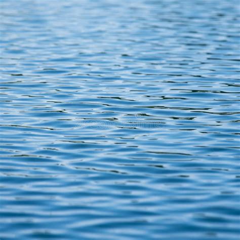 Rippling Water Surface With Gentle Waves Creating A Textured Pattern The Water Is A Stock