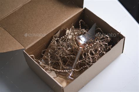 Delivery Box From A Store And Discovers A Broken Glass An Improperly Packed Item Stock Photo By