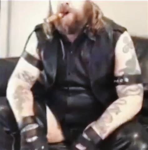 Bearded Biker Daddy Wearing Full Gear Smoking Cigar