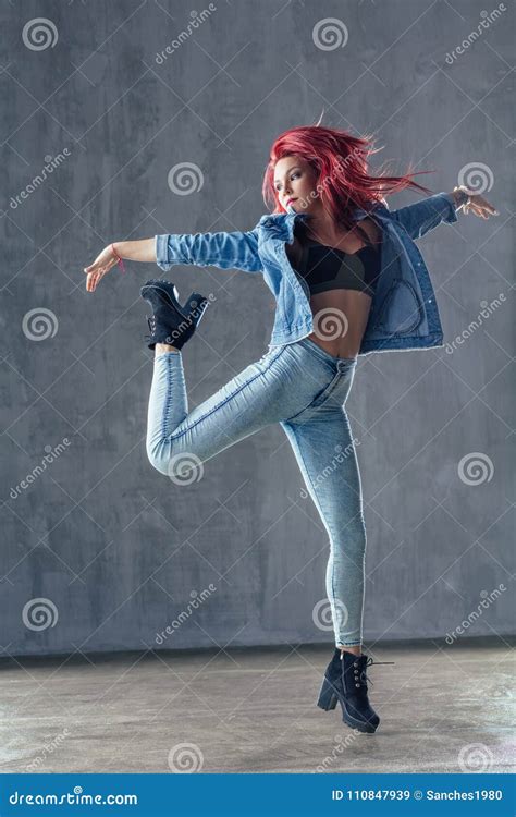 Young Beautiful Female Dancer Is Posing In The Studio Stock Image