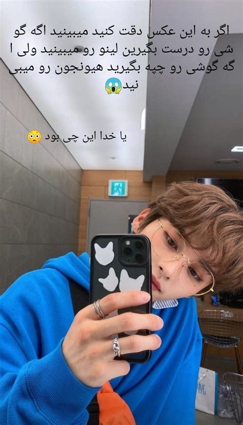 A Young Man Taking A Selfie With His Cell Phone In Front Of Him