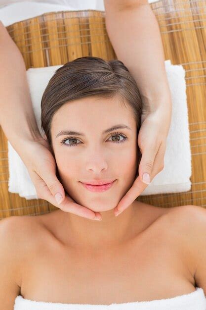 Premium Photo Attractive Young Woman Receiving Facial Massage At Spa
