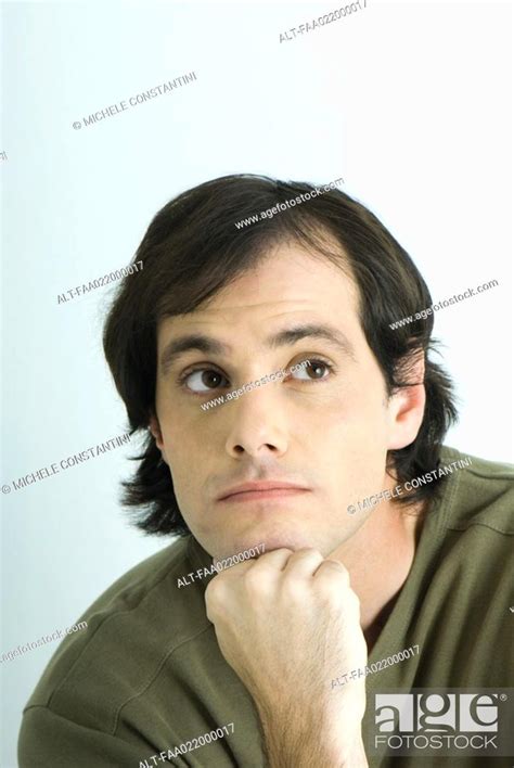 Man Resting Chin On Hand Looking Away Portrait Stock Photo Picture