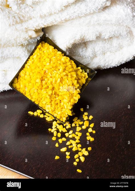 Spa Massage Border Background With Towel Stacked And Yellow Sea Salt On