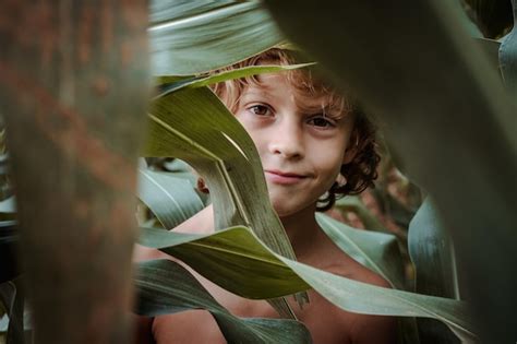 Premium Photo Charming Blond Haired Kid With Brown Eyes And Naked