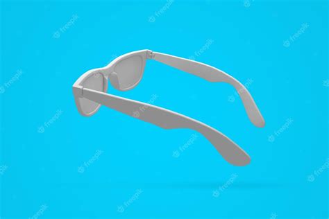 Premium Photo White Sunglasses On A Bright Blue Background Summertime