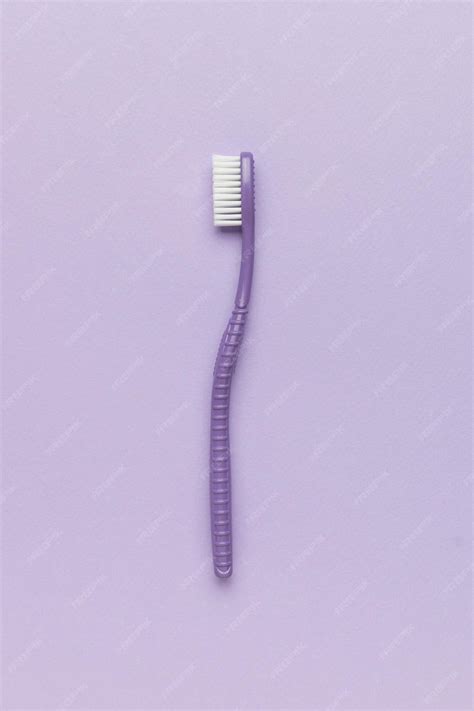 Premium Photo A Purple Toothbrush On A Purple Background