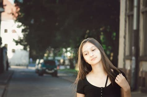 Portrait Of Young Beautiful Pretty Woman With Long Hair Posing In City