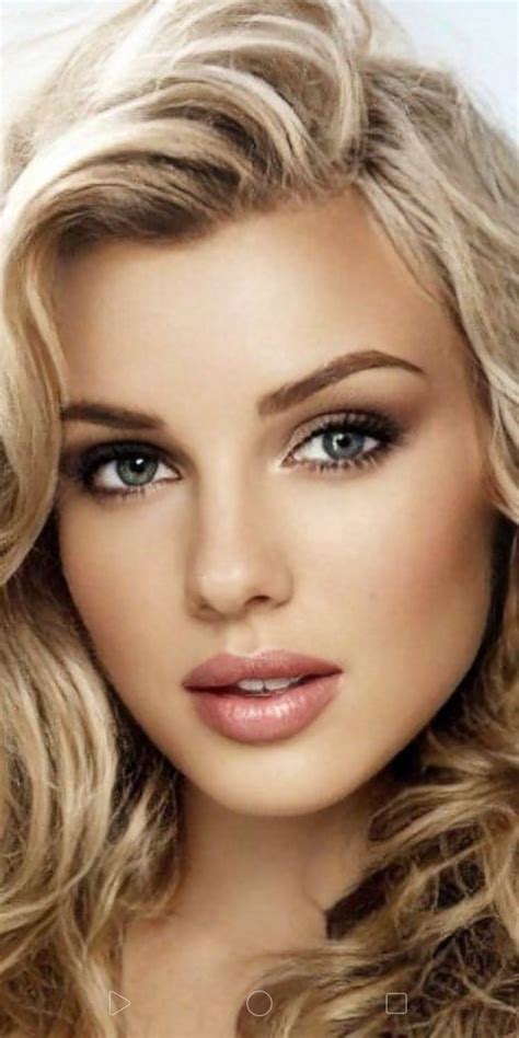 A Woman With Blonde Hair And Blue Eyes