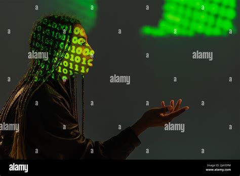 Side View Of African American Woman With Binary Code On Face On Grey Background Stock Photo Alamy