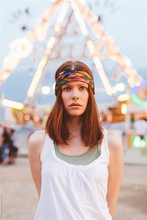 Portrait Of A Redhead Woman At Amusement Park By Stocksy Contributor