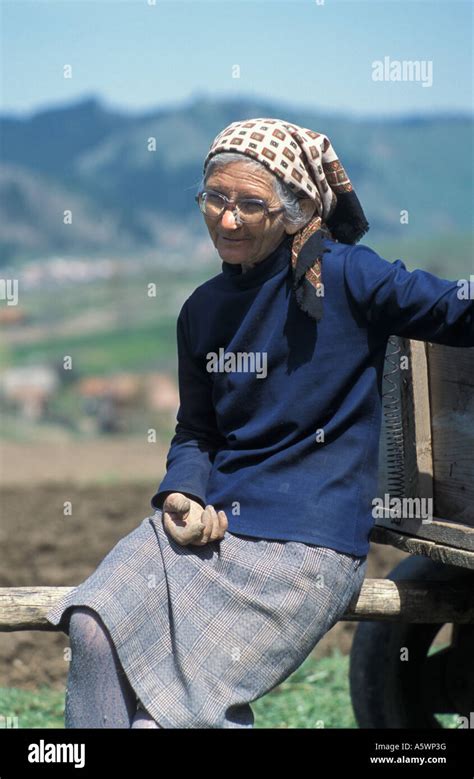 A Szekely Hungarian Farmer And Grandmother Takes A Break During Potato