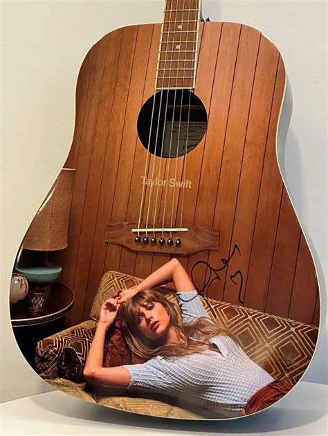 Taylor Swift Gives Signed Guitar To Charity Auction Tales From The