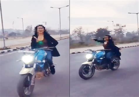 Girl Stunt On Bike Video चलती बाइक पर स्टंट कर रही लड़की वीडियो वायरल