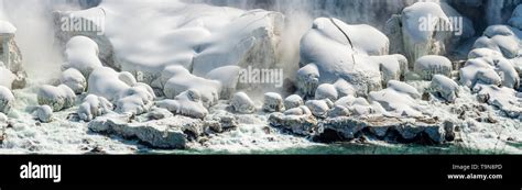 Winter Scene Of Niagara Falls In Canada Showing Frozen Snow Covered