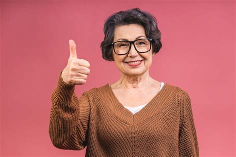 Premium Photo Beautiful Old Woman Grandmother Looking At Camera And