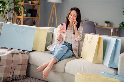 Full Size Photo Of Nice Cheerful Girl Sit Barefoot Couch Use Smart
