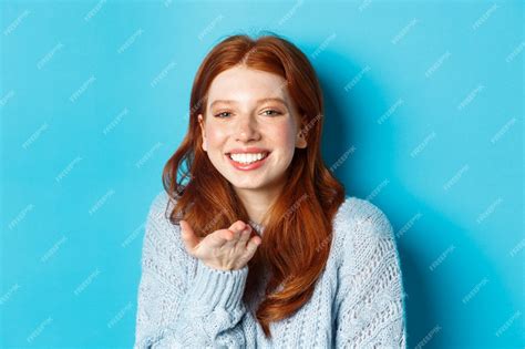 Free Photo Lovely Redhead Female Model Smiling Sending Air Kiss At