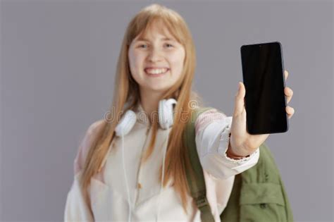 Smiling Trendy Teenage Girl Showing Smartphone Blank Screen Stock Photo