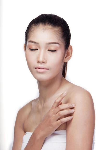 Premium Photo Woman With Eyes Closed Touching Herself Against White