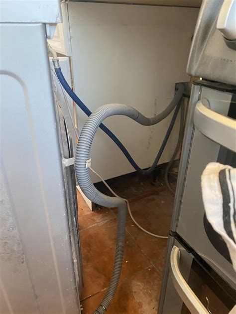 Water From Washing Machine Backing Up Into Kitchen Sink Then Going