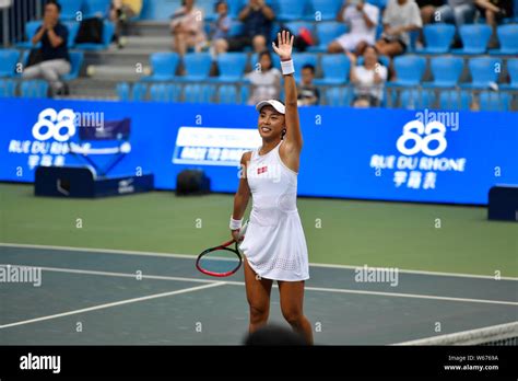 Wang Qiang Of China Waves To Fans After Defeating Magda Linette Of