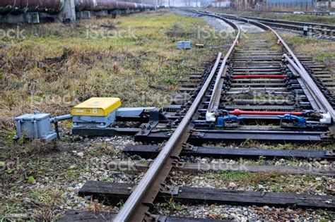 Railway In The Industrial Zone Empty Rails With A Semaphore In