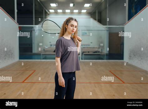 Female Player Poses With Squash Racket On Court Stock Photo Alamy