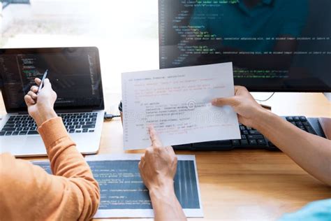 Asian Team Outsource Developer Looking Screen Programming Code Working