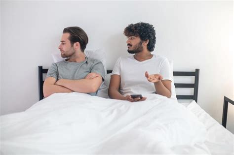 Premium Photo Argument Two Men Having An Argument One Of Them Looking Offended