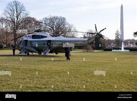 United States President Donald J Trump Walks Across The South Lawn Of