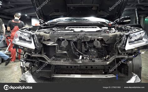 Assembling Hood Of Car In Automotive Plant Action Close Up Of Details