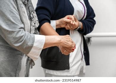 Doctors Helping Elderly Woman Walk Images Stock Photos Vectors