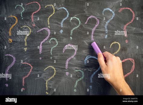 Too Many Questions Man Drawing Colorful Question Marks On A Blackboard