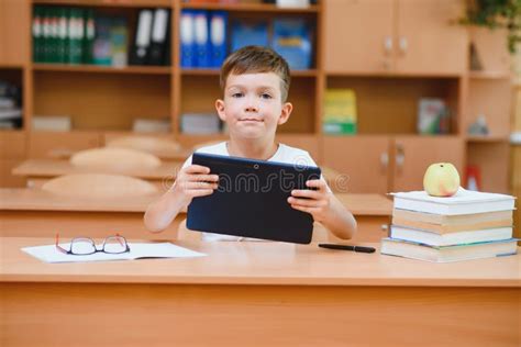 School Boy Using Tablet Compute In Classroom Stock Image Image Of