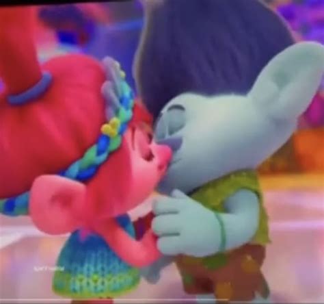 A Cartoon Character Kissing Another Character On The Cheek